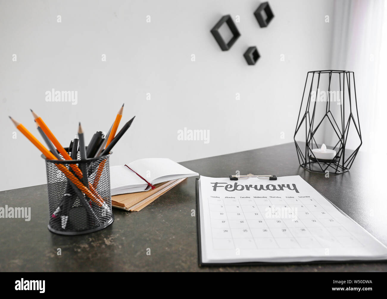 Paper sheet with calendar and stationery on office table Stock Photo ...