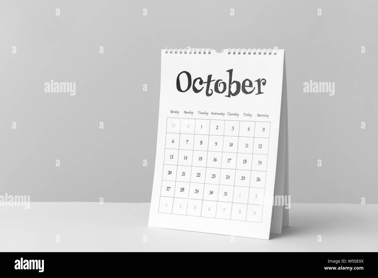 Flip calendar on table against light background Stock Photo - Alamy