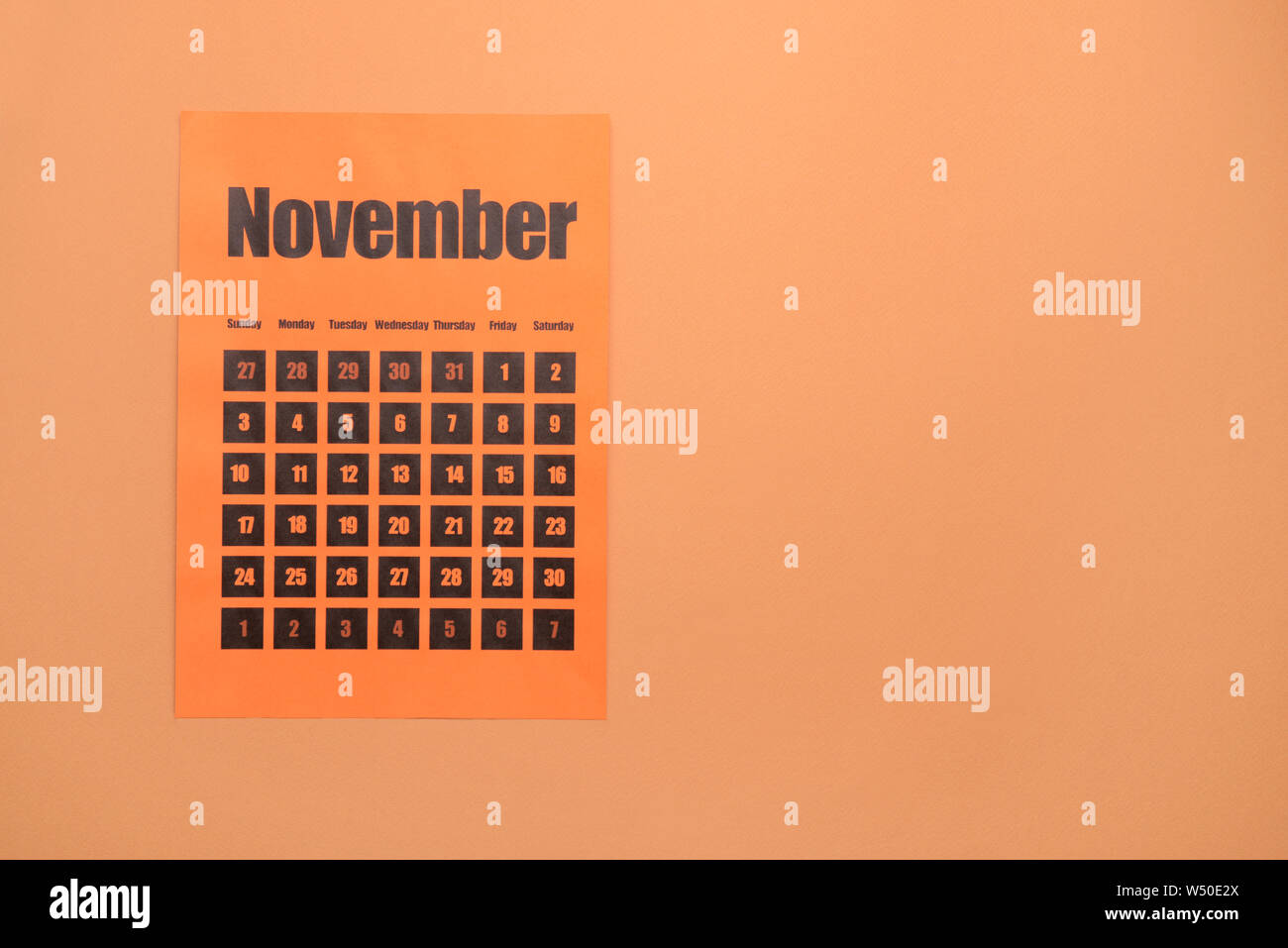 Sheet of paper calendar on color background Stock Photo - Alamy