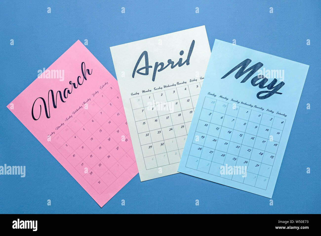 Sheets of paper calendar with spring months on color background Stock ...