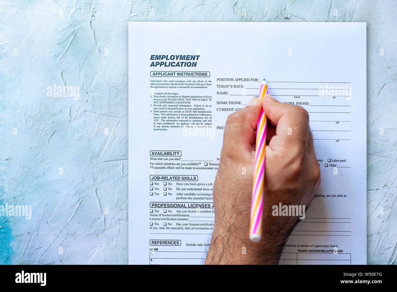 Hand filling Standard Application for Employment. HR, Hiring, Applicant ...