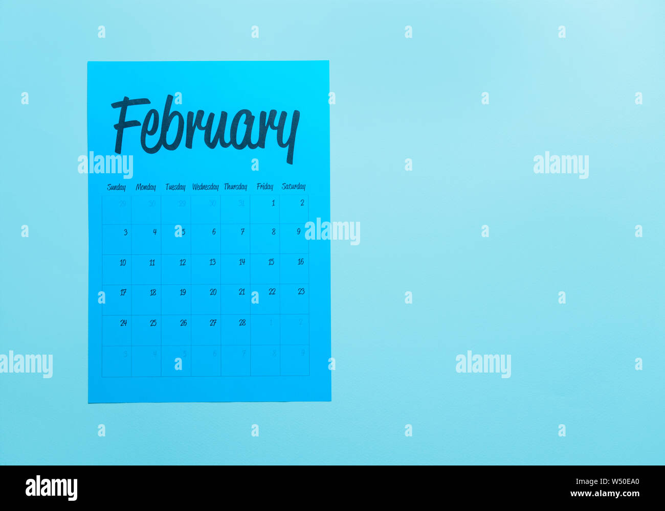 Sheet of paper calendar on color background Stock Photo - Alamy