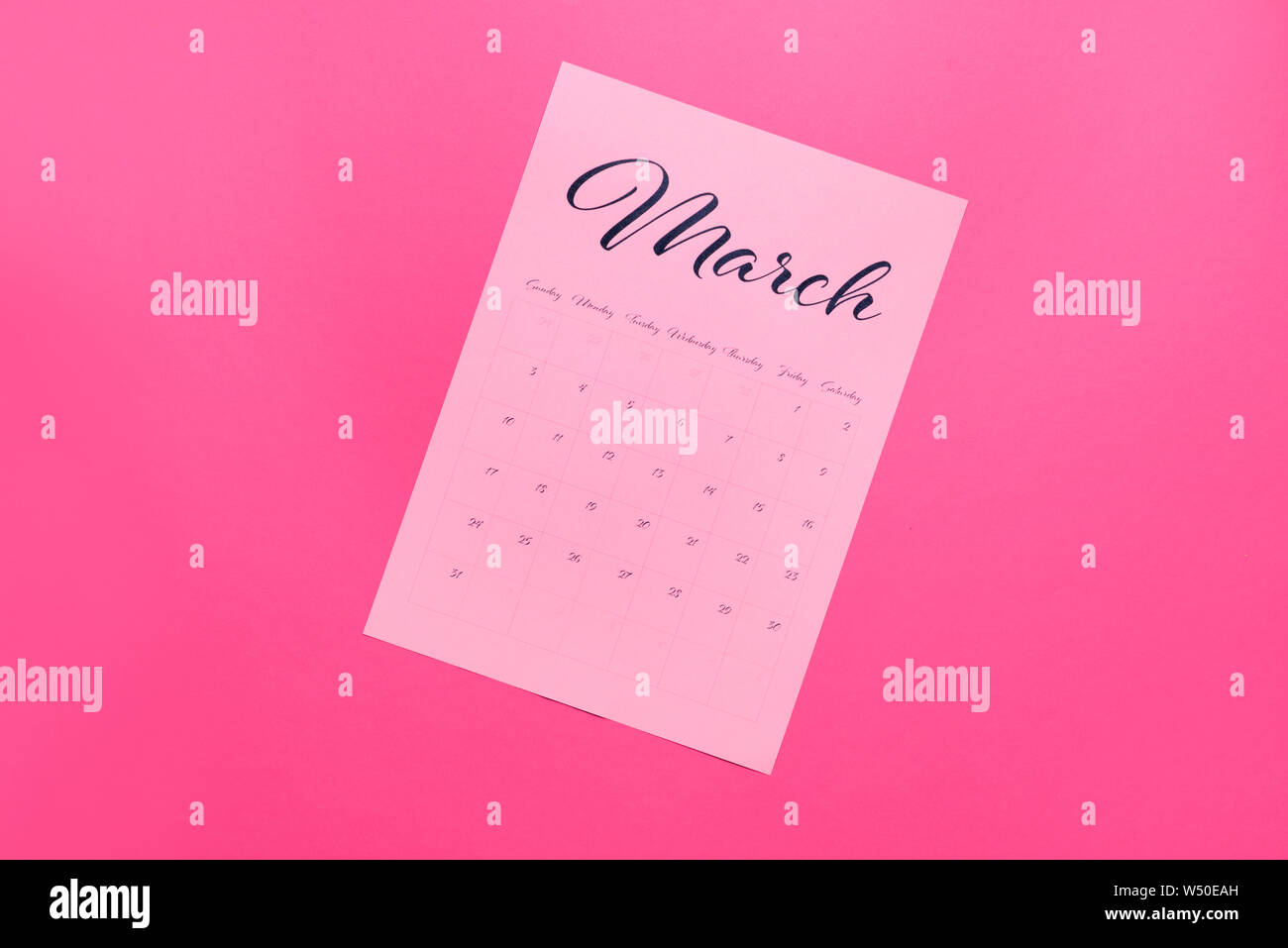 Sheet of paper calendar on color background Stock Photo - Alamy