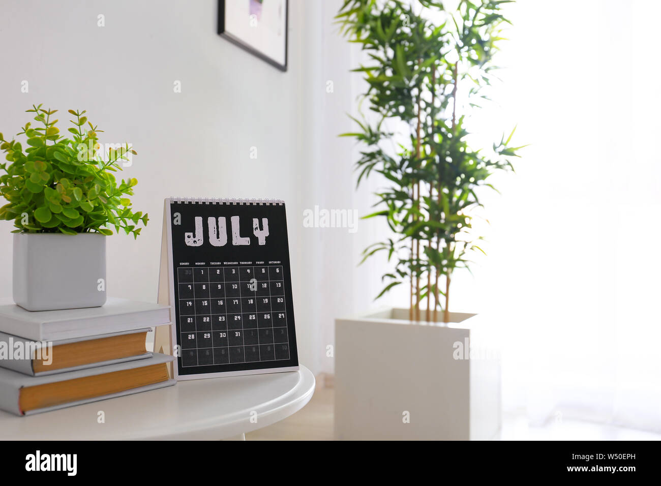 Flip calendar on table in room Stock Photo - Alamy