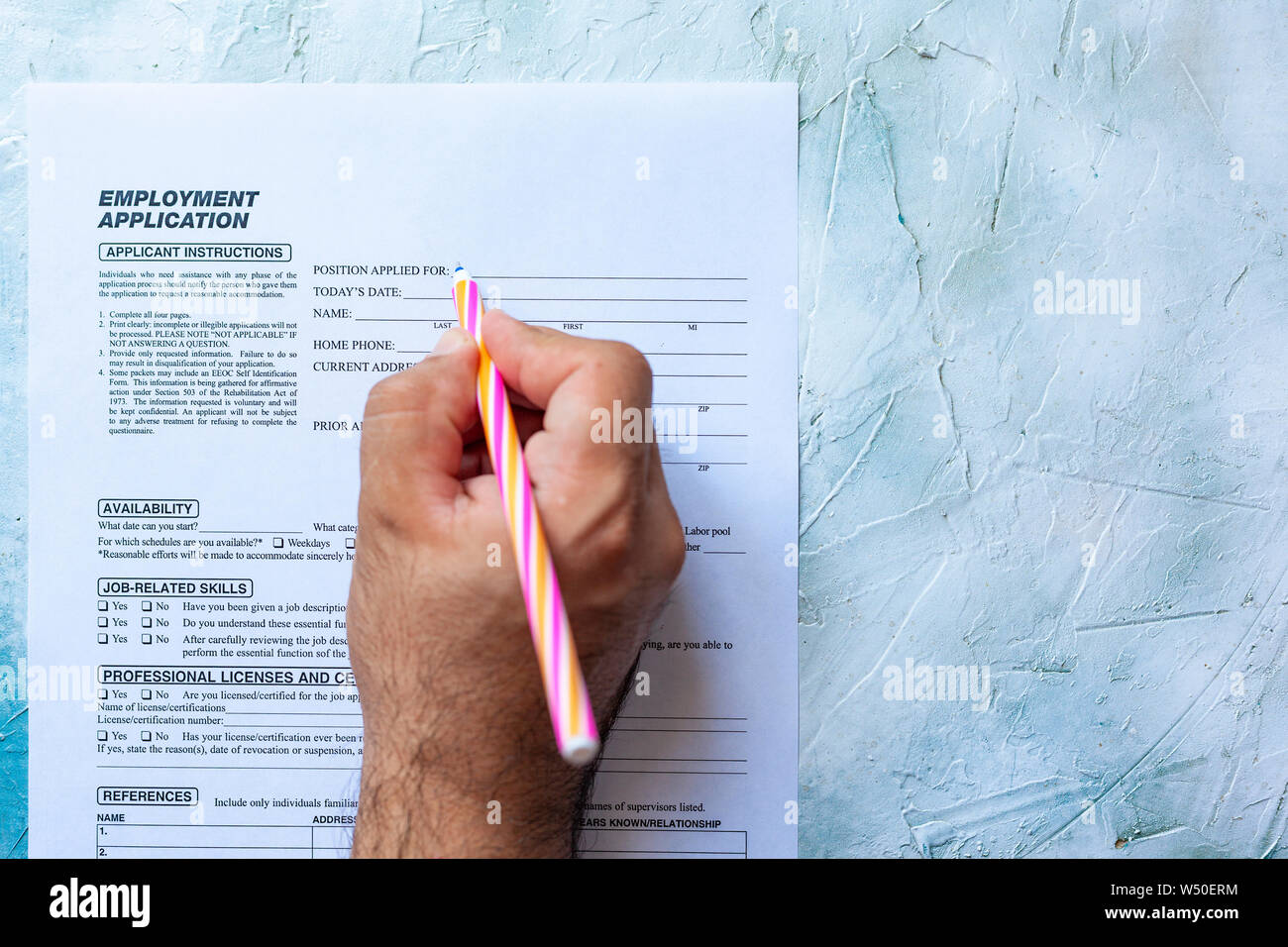 Hand filling Standard Application for Employment. HR, Hiring, Applicant ...