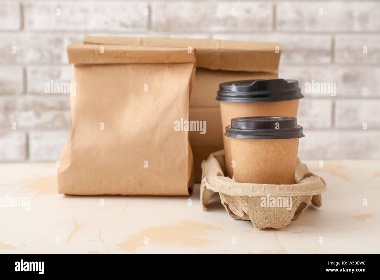 Assortment of food delivery containers on table Stock Photo - Alamy