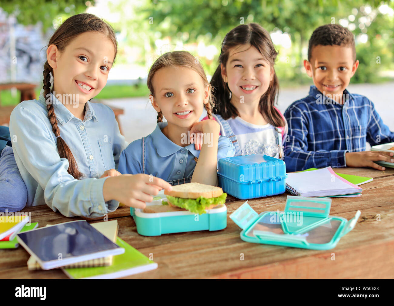 Little children having lunch outdoors Stock Photo - Alamy