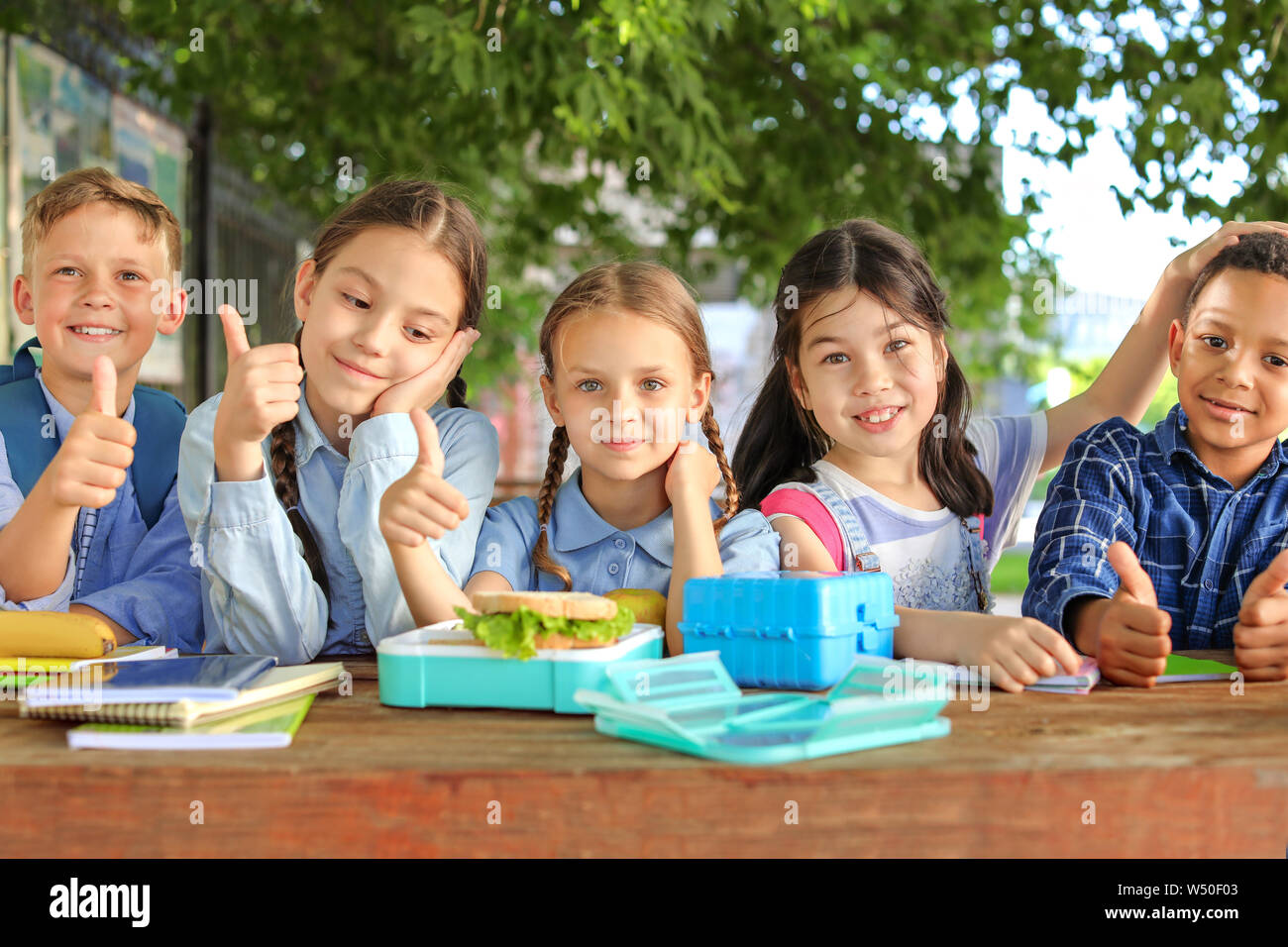Little children having lunch outdoors Stock Photo - Alamy