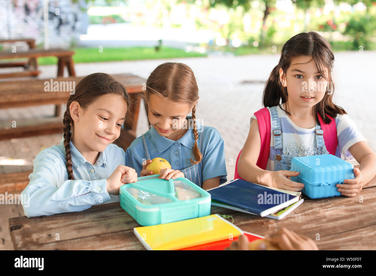 Little children having lunch outdoors Stock Photo - Alamy