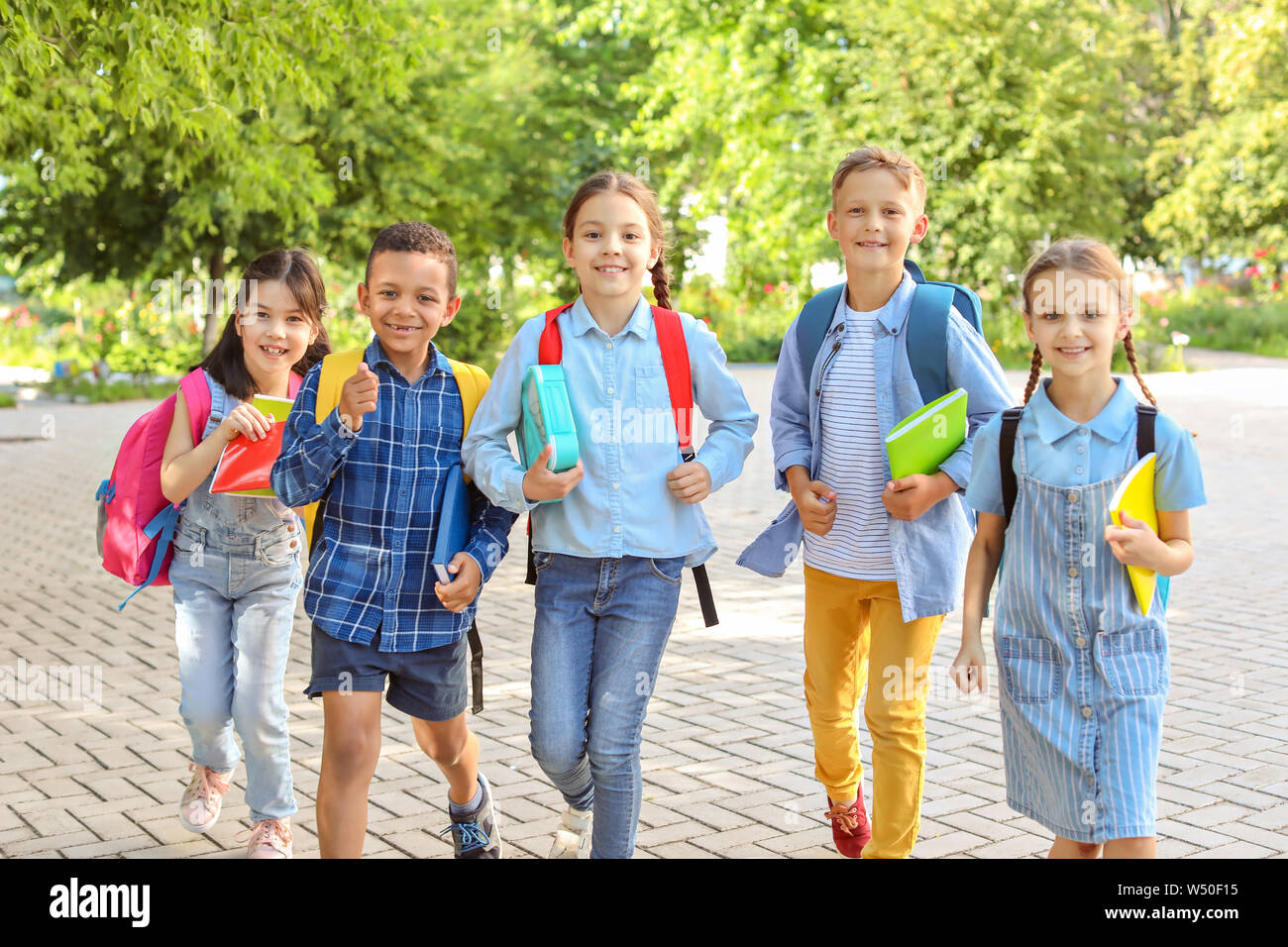 Group of cute little pupils outdoors Stock Photo - Alamy