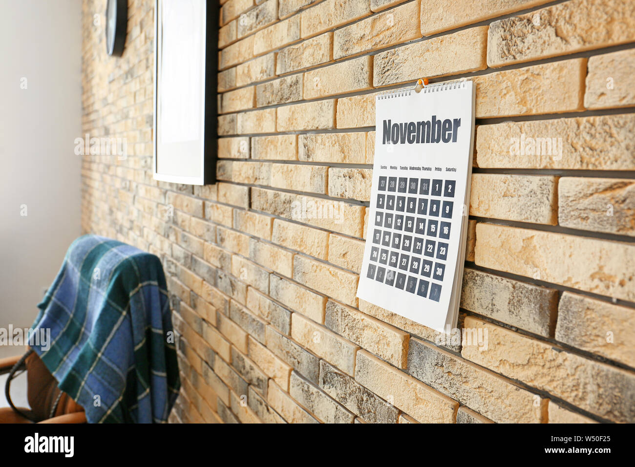 Flip calendar hanging on wall Stock Photo - Alamy