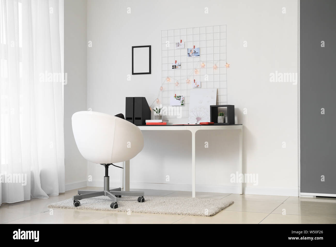 Workplace with mood board in modern room Stock Photo - Alamy