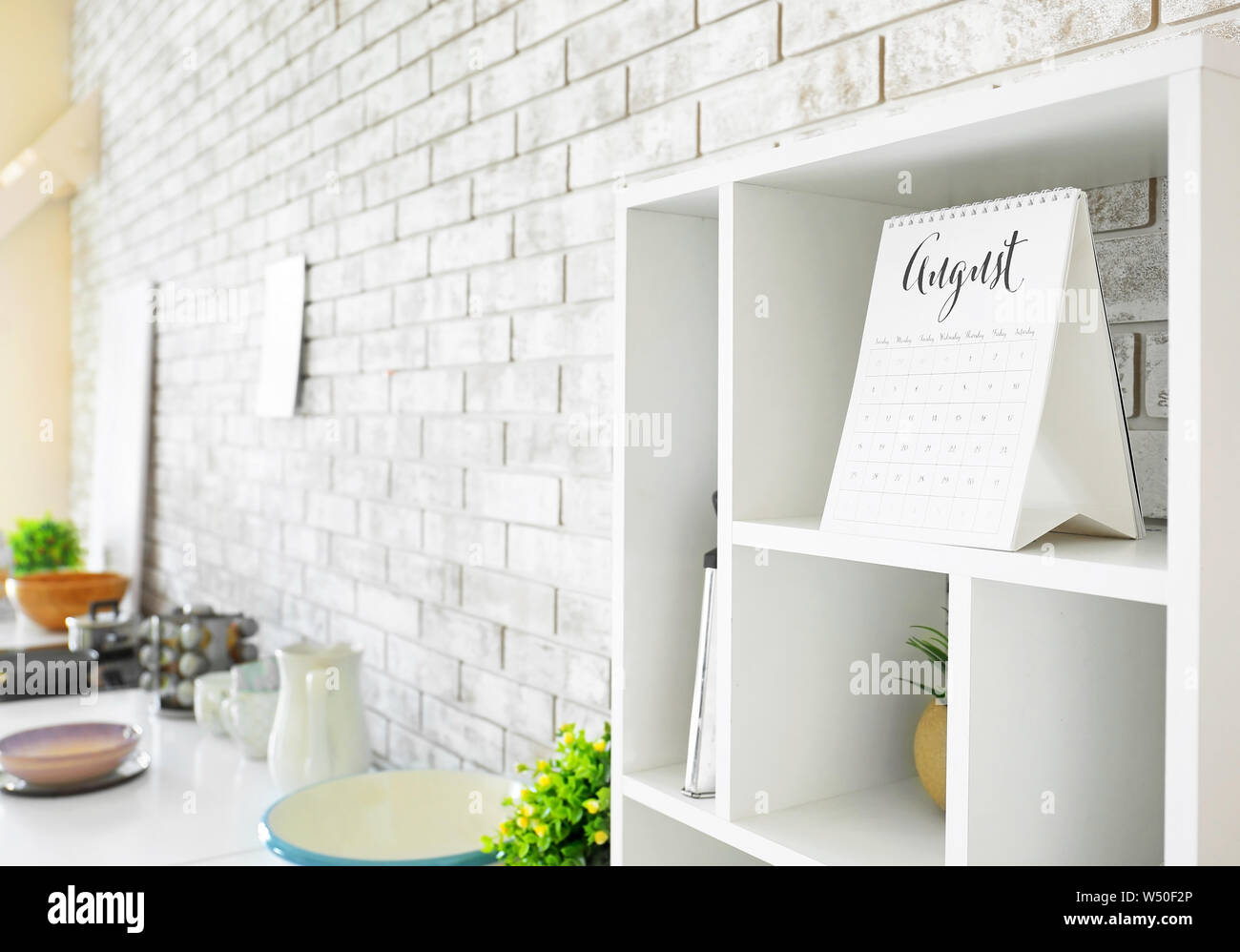 Flip calendar on shelf in kitchen Stock Photo - Alamy