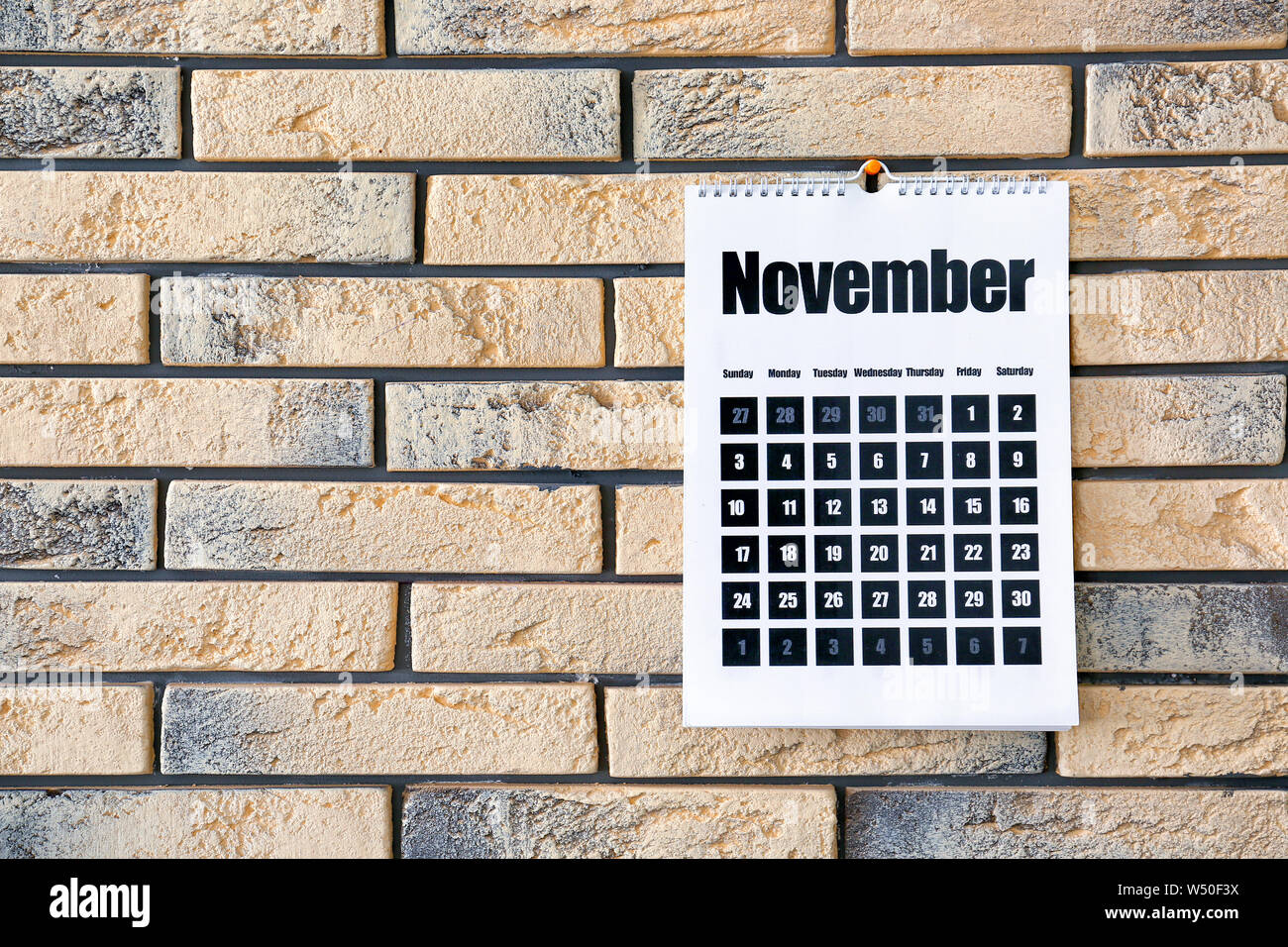Flip calendar hanging on wall Stock Photo - Alamy