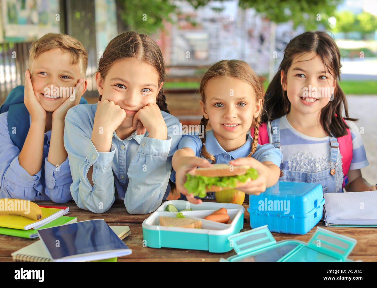 Little children having lunch outdoors Stock Photo - Alamy