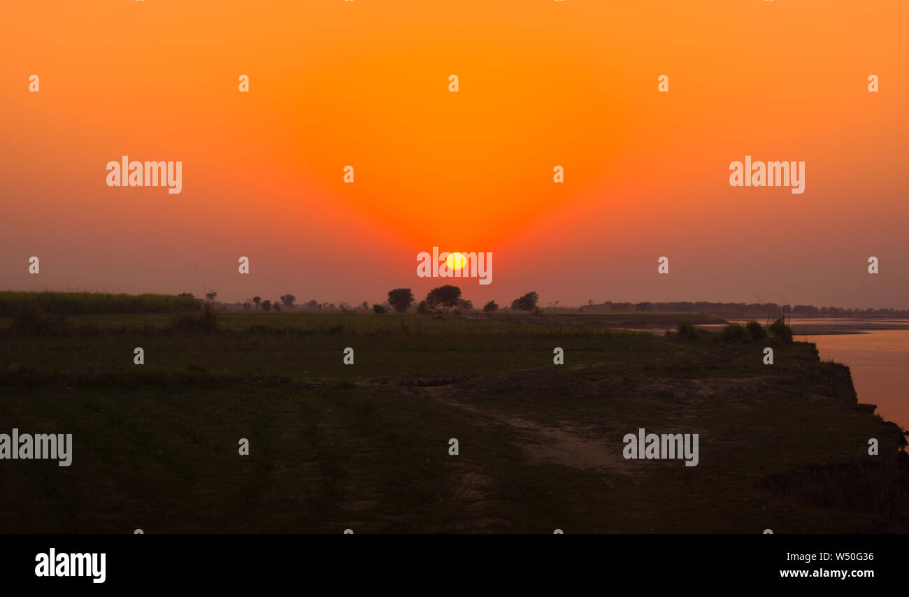 landscape image of sun set on green fields,beautiful landscape image of ...