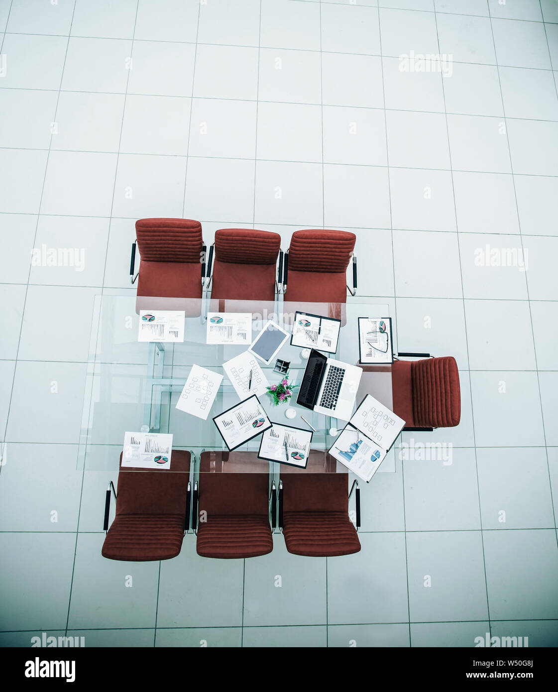 top view - financial charts,marketing charts,notebooks and pens at the ...