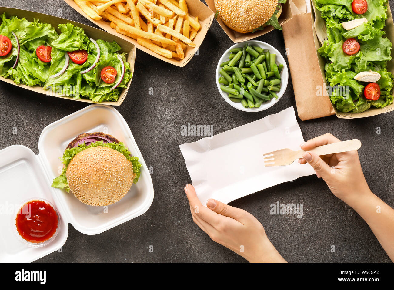 Woman having lunch received from food delivery service Stock Photo - Alamy