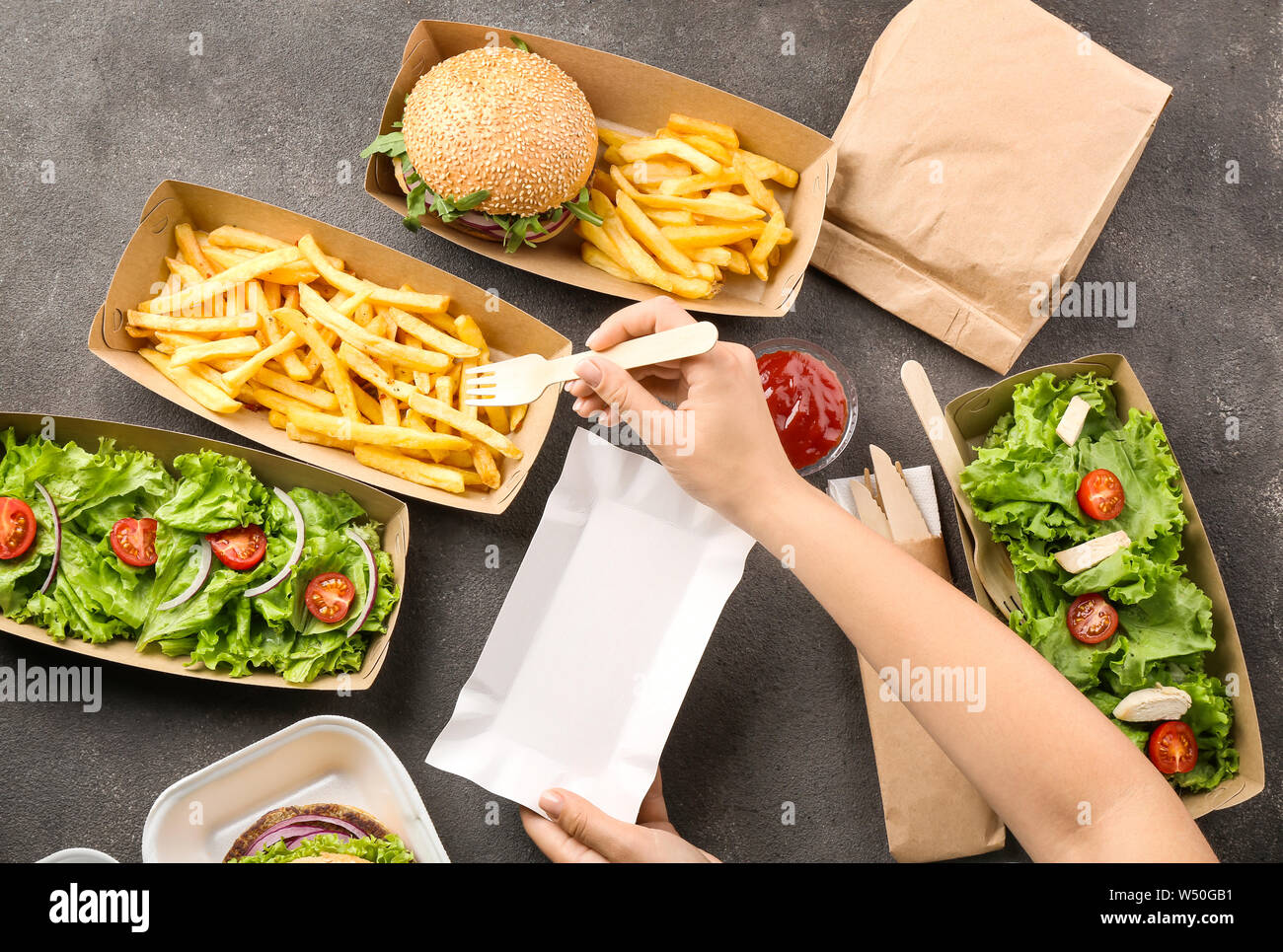 Woman having lunch received from food delivery service Stock Photo - Alamy