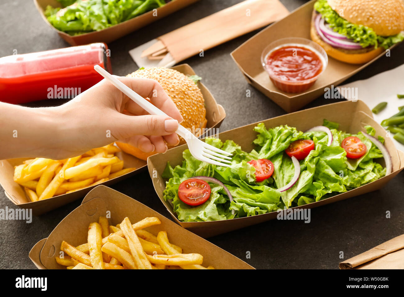Woman having lunch received from food delivery service Stock Photo - Alamy