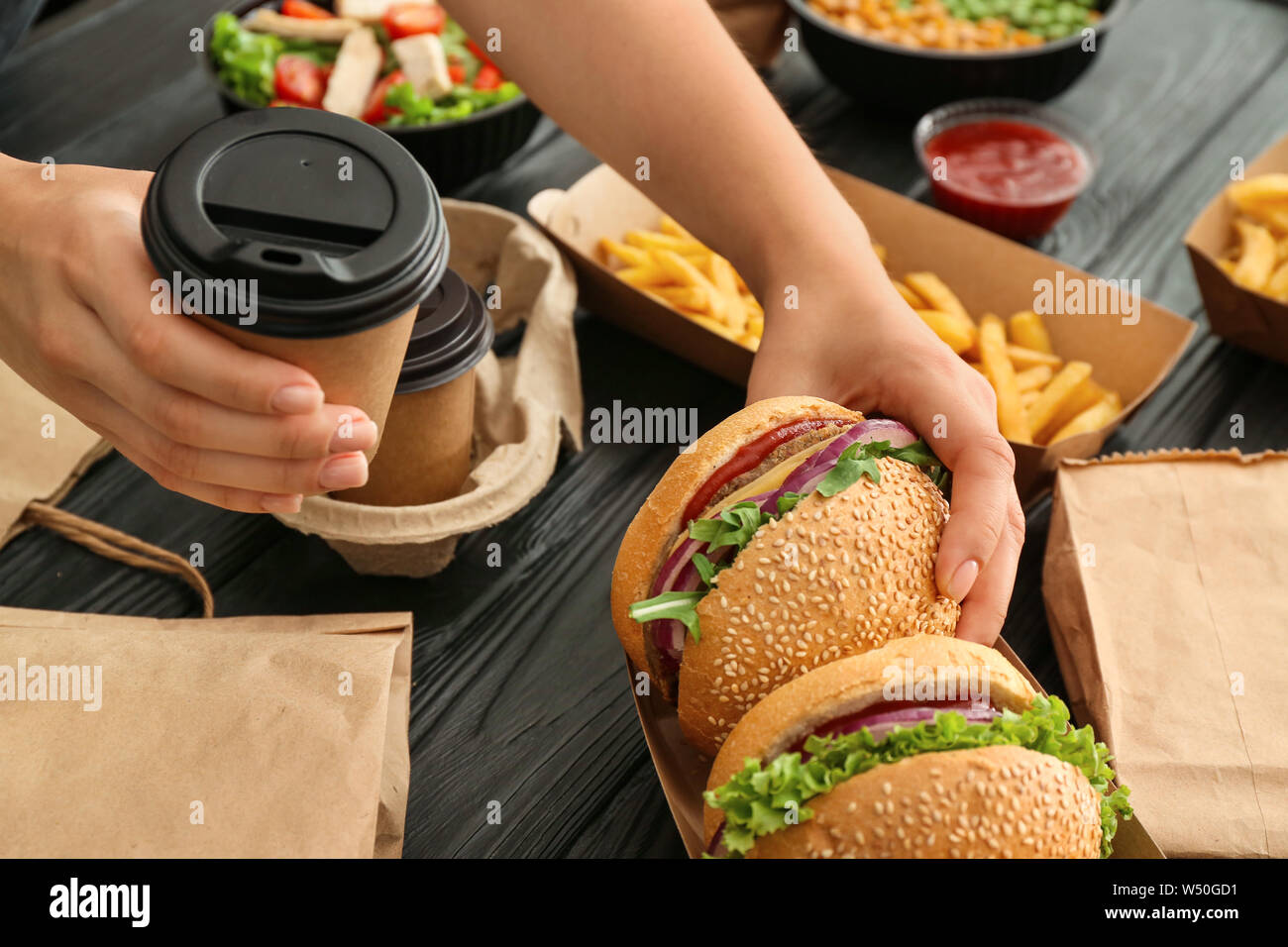 Worker of food delivery service packing order for customer Stock Photo ...