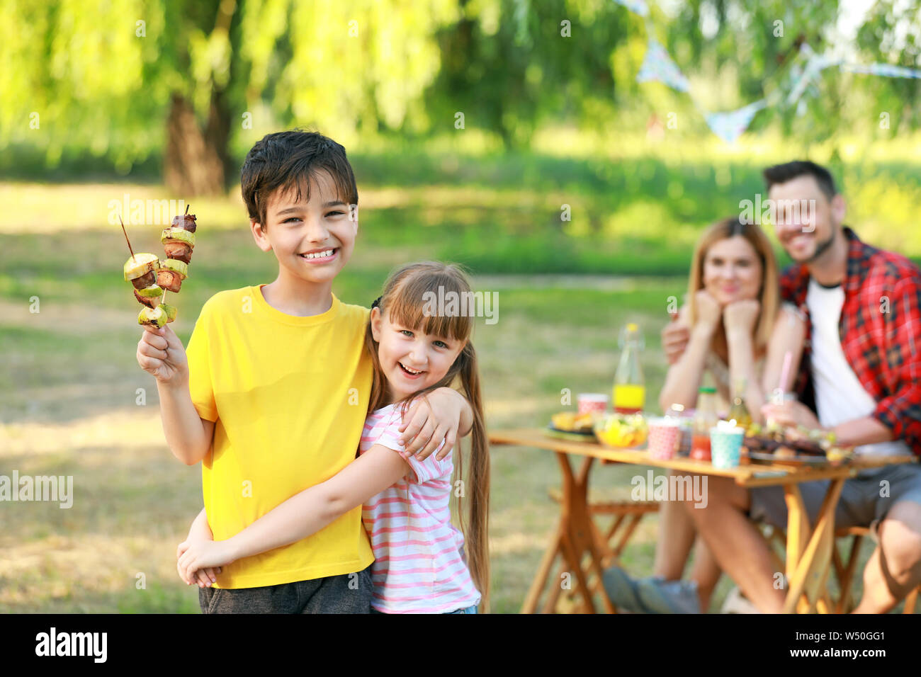 Happy little children having picnic on summer day Stock Photo - Alamy