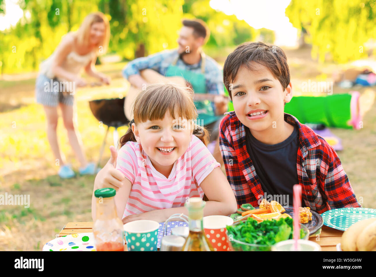 Happy little children having picnic on summer day Stock Photo - Alamy