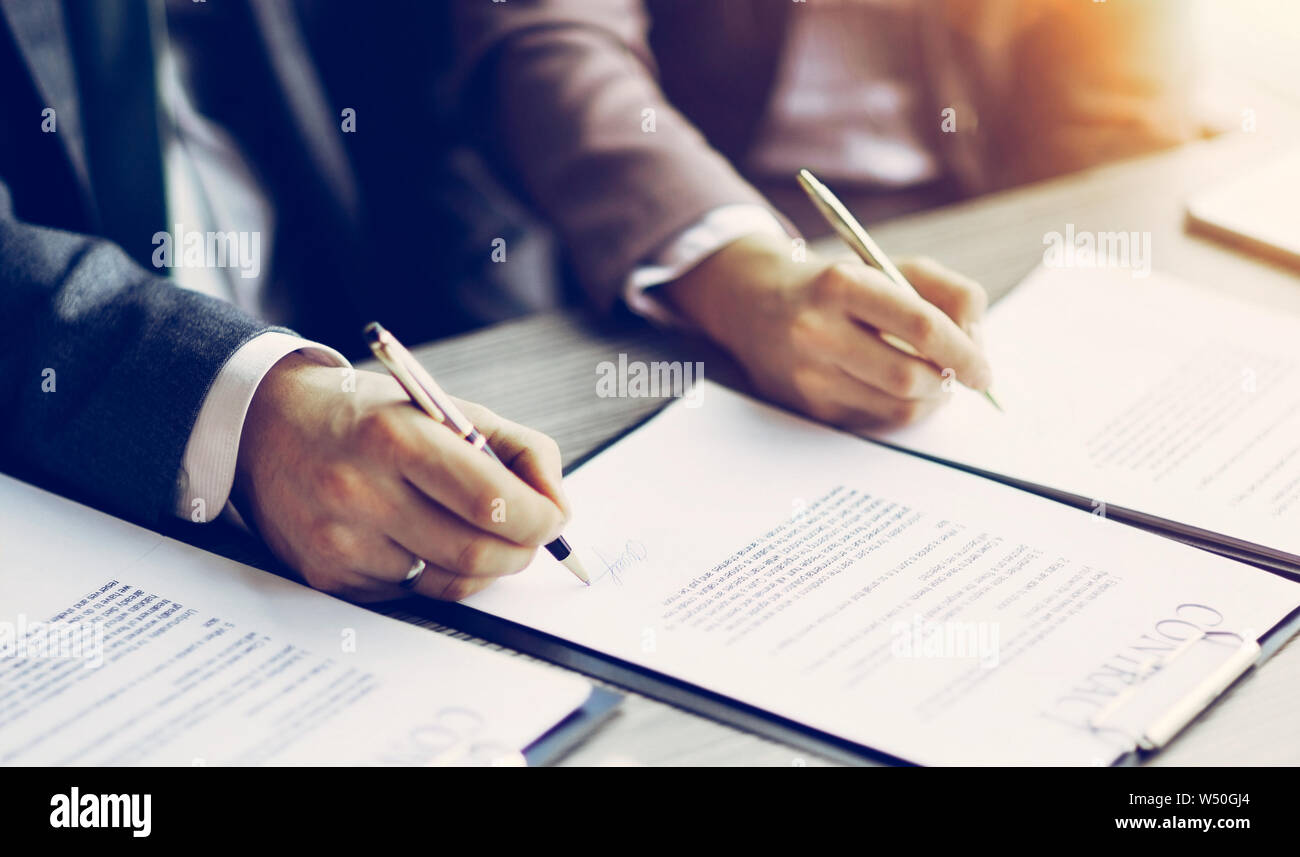 Business young people in the job interview, signed an employment ...