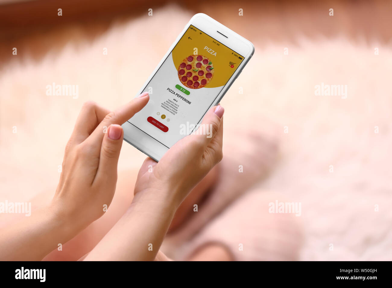 Woman with mobile phone ordering food online Stock Photo - Alamy