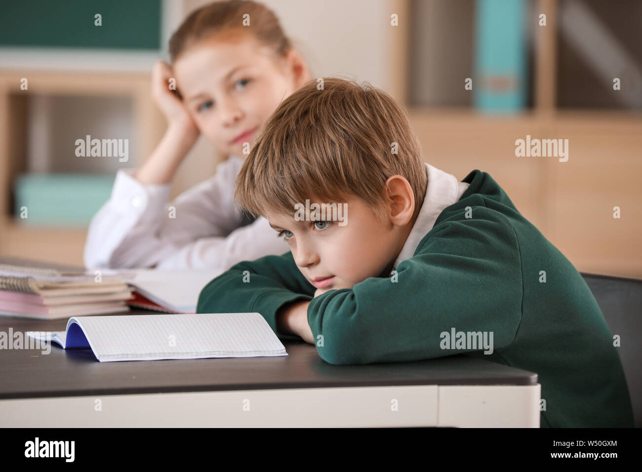 Bored little children during lesson in classroom Stock Photo - Alamy