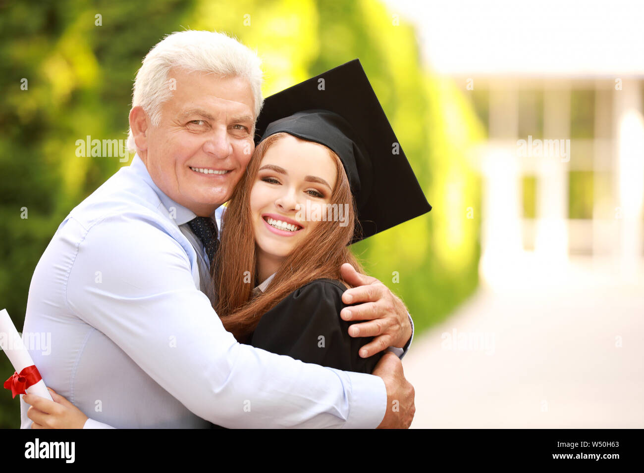 Father greeting his daughter on graduation day Stock Photo - Alamy