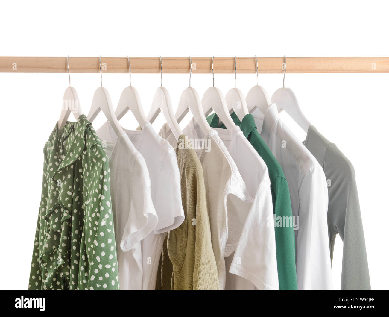Rack with hanging clothes on white background Stock Photo - Alamy