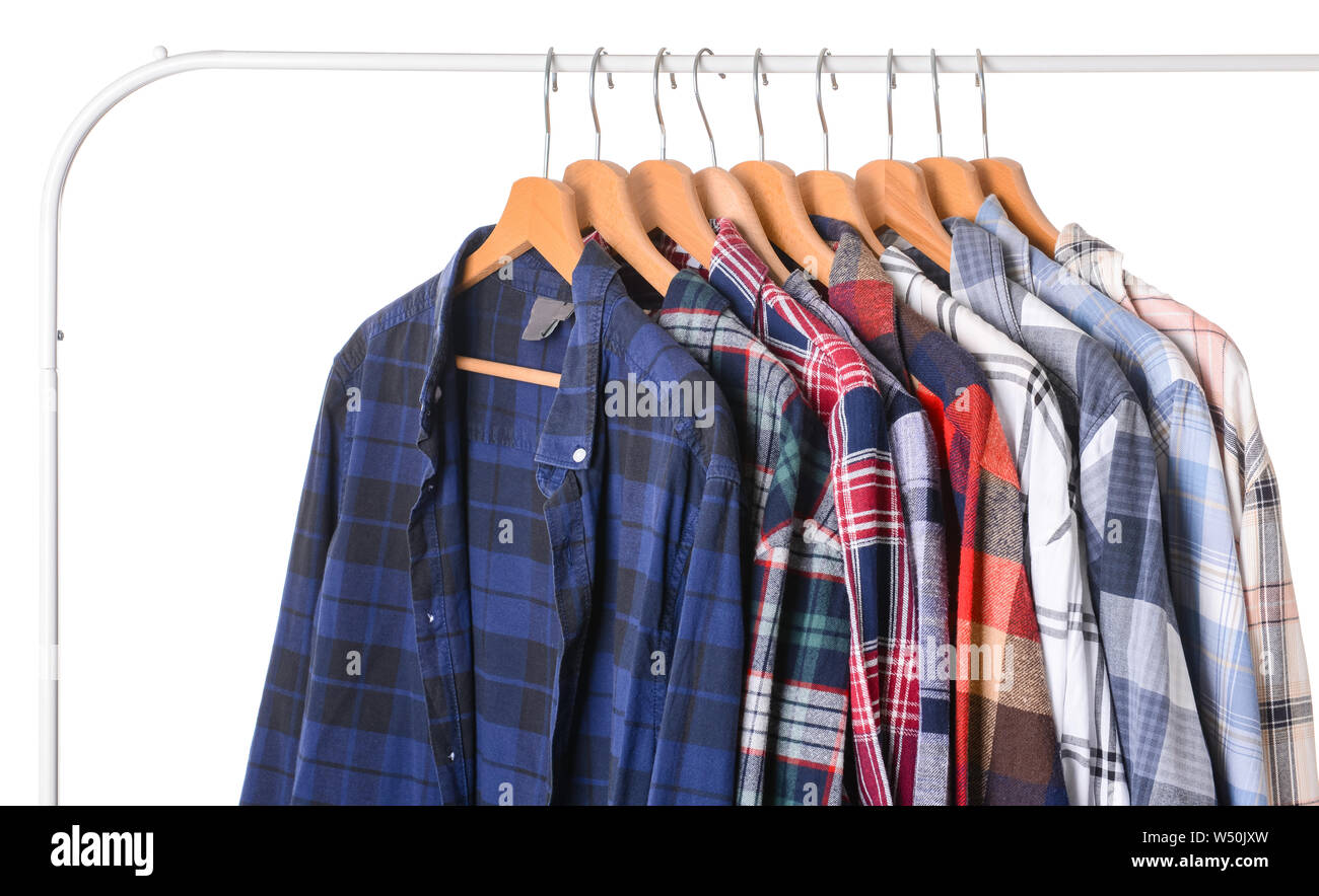 Rack with hanging clothes on white background Stock Photo - Alamy