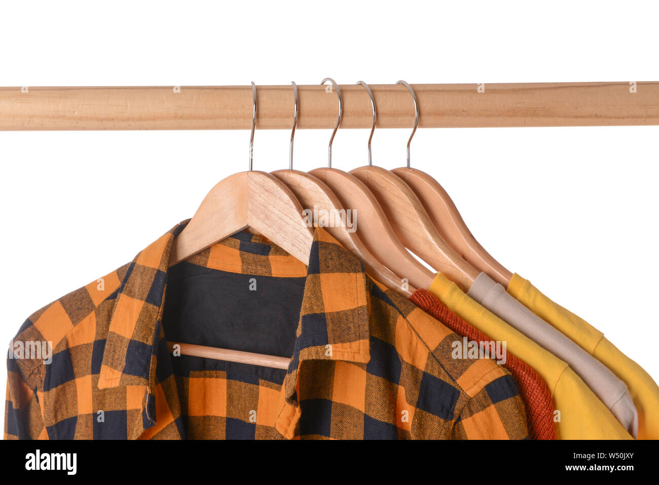 Rack with hanging clothes on white background, closeup Stock Photo - Alamy