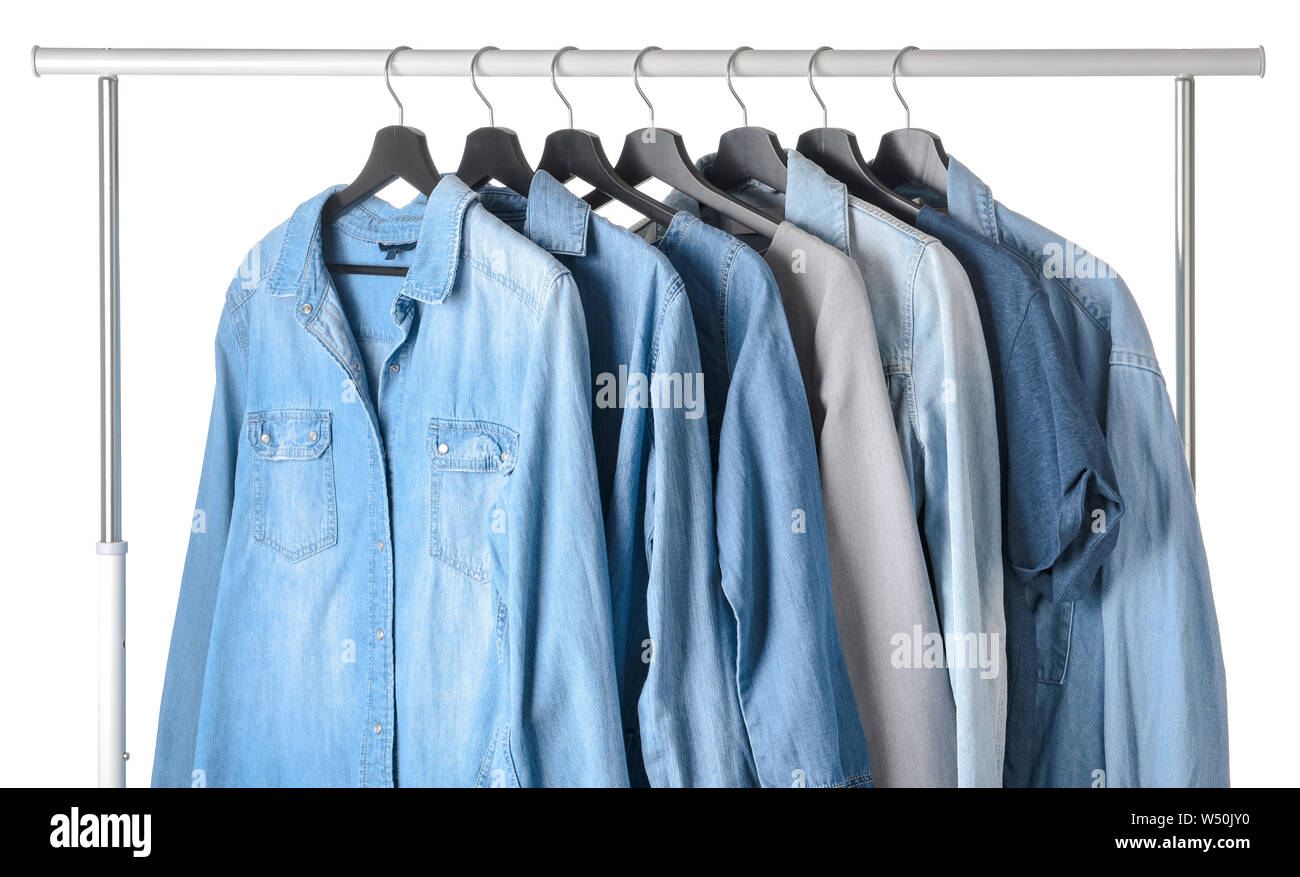 Rack with hanging clothes on white background Stock Photo - Alamy