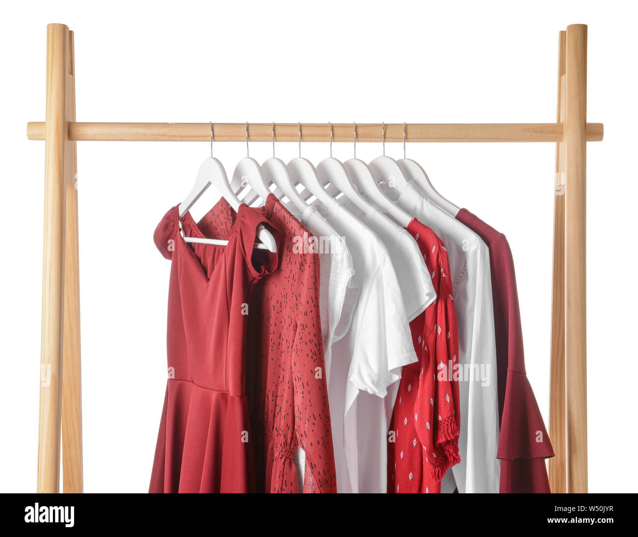 Rack with hanging clothes on white background Stock Photo - Alamy