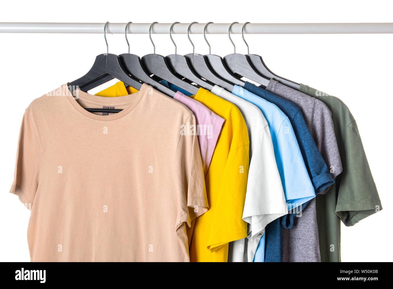 Rack with hanging clothes on white background Stock Photo - Alamy