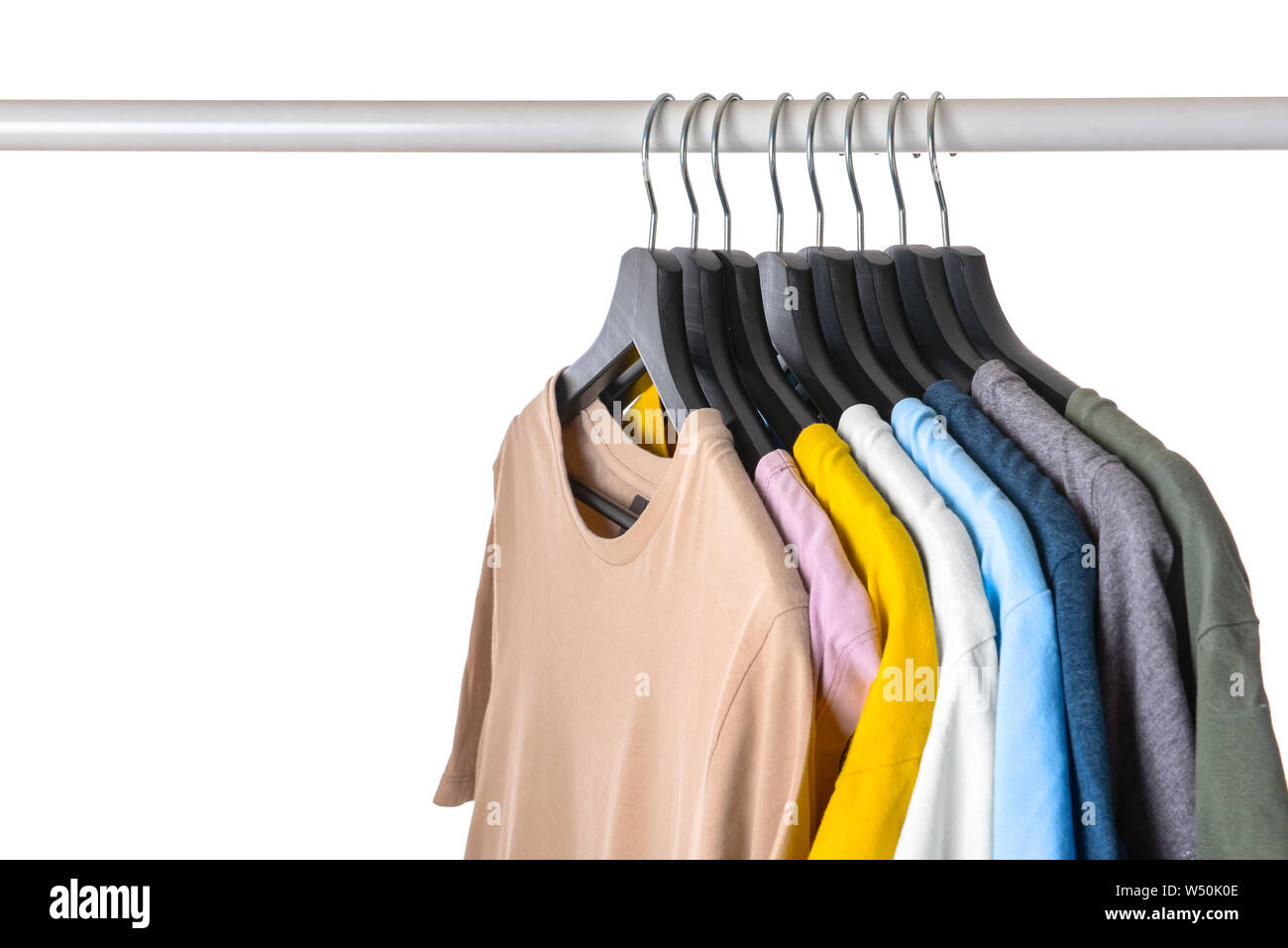 Rack with hanging clothes on white background Stock Photo - Alamy