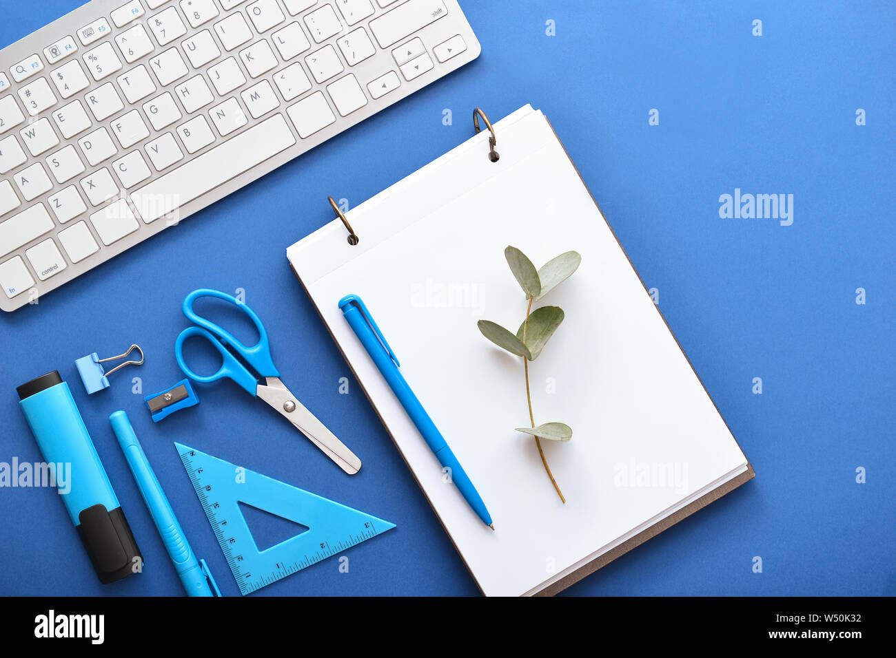 Composition with stationery and computer keyboard on color background ...