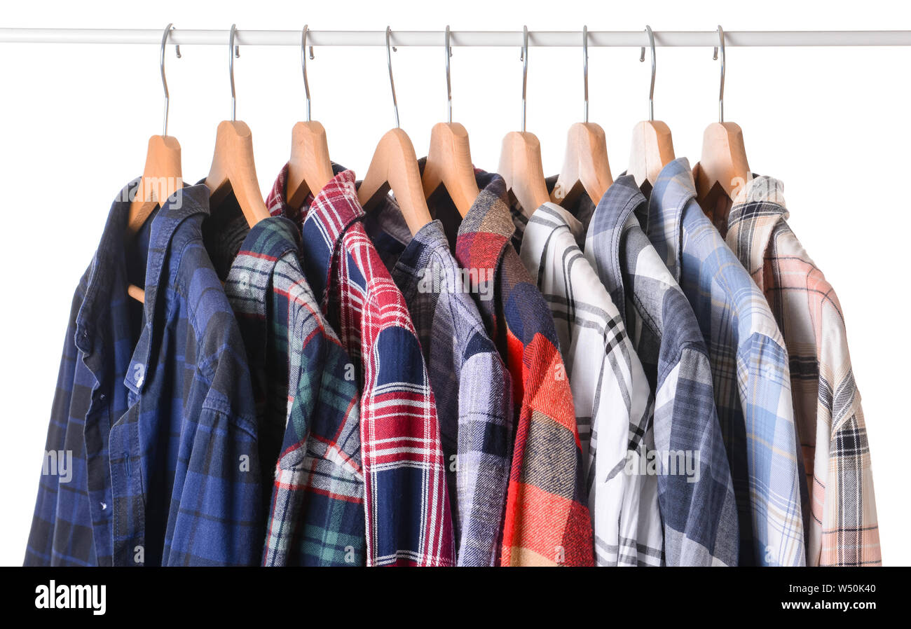 Rack with hanging clothes on white background Stock Photo - Alamy