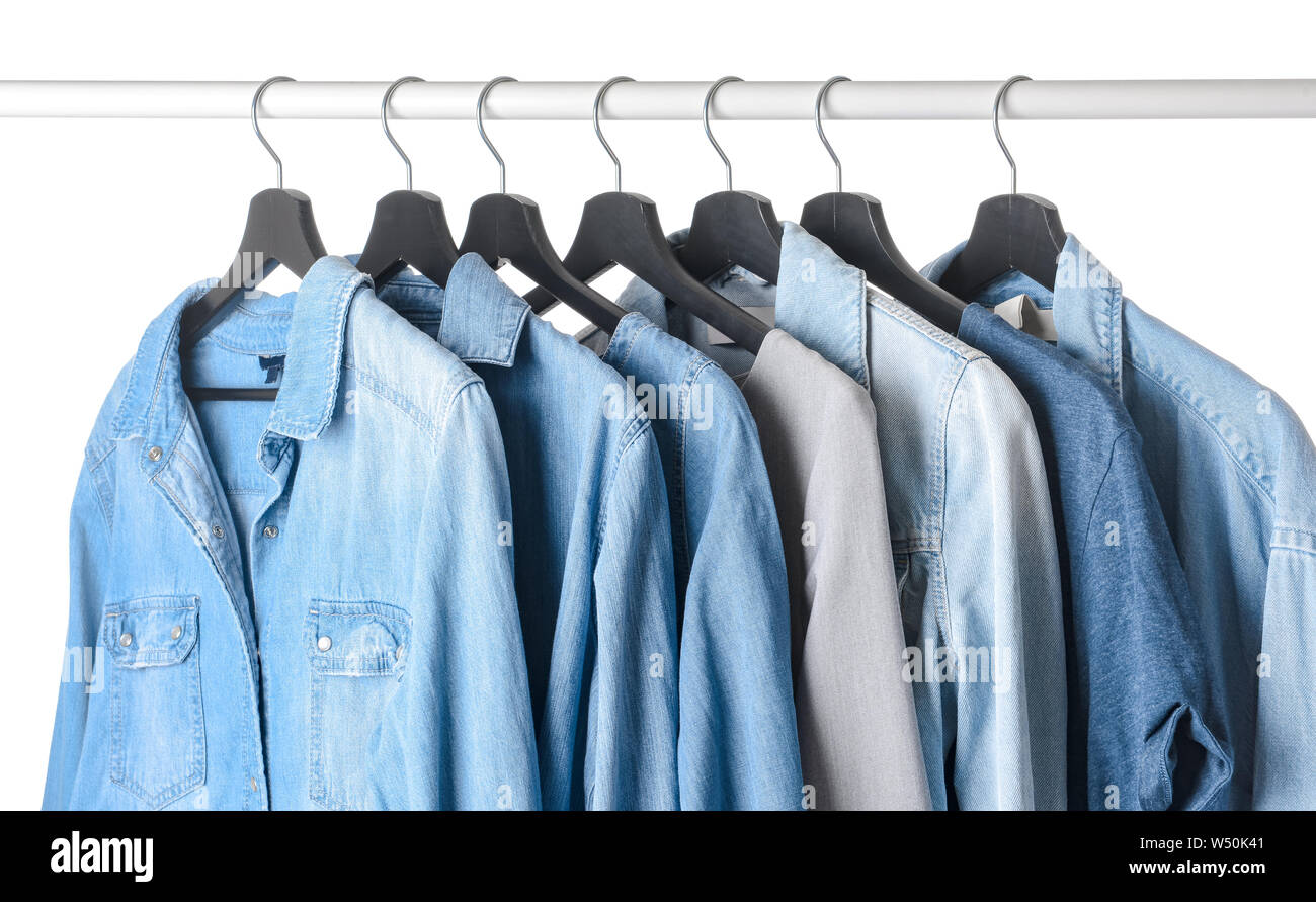 Rack with hanging clothes on white background Stock Photo - Alamy