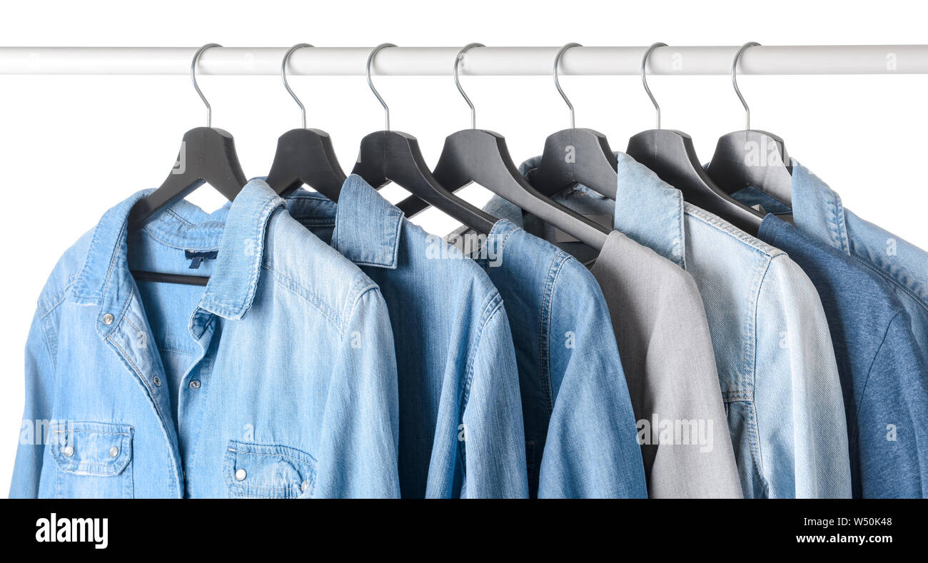 Rack with hanging clothes on white background Stock Photo - Alamy