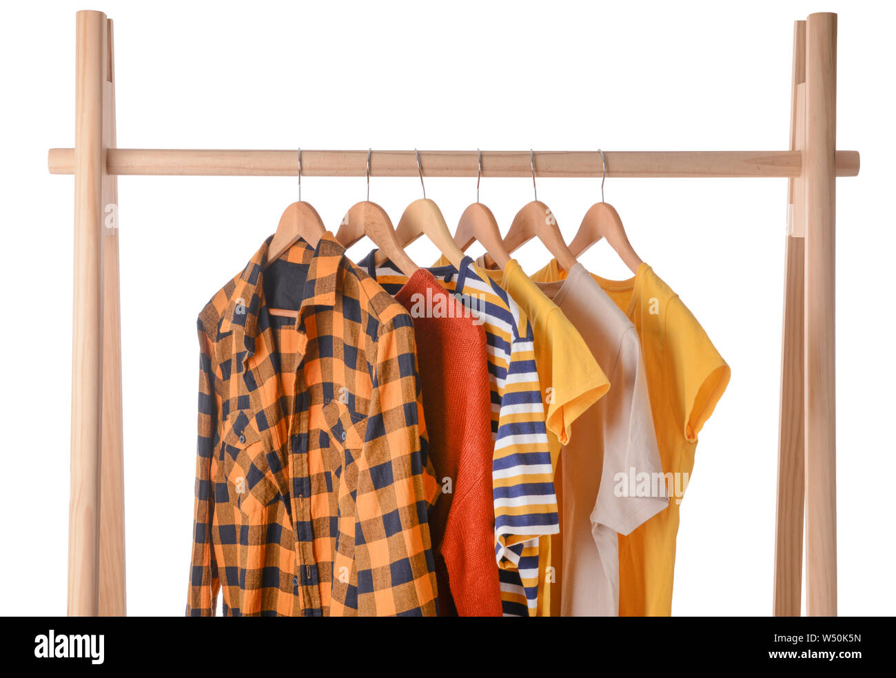 Rack with hanging clothes on white background Stock Photo - Alamy