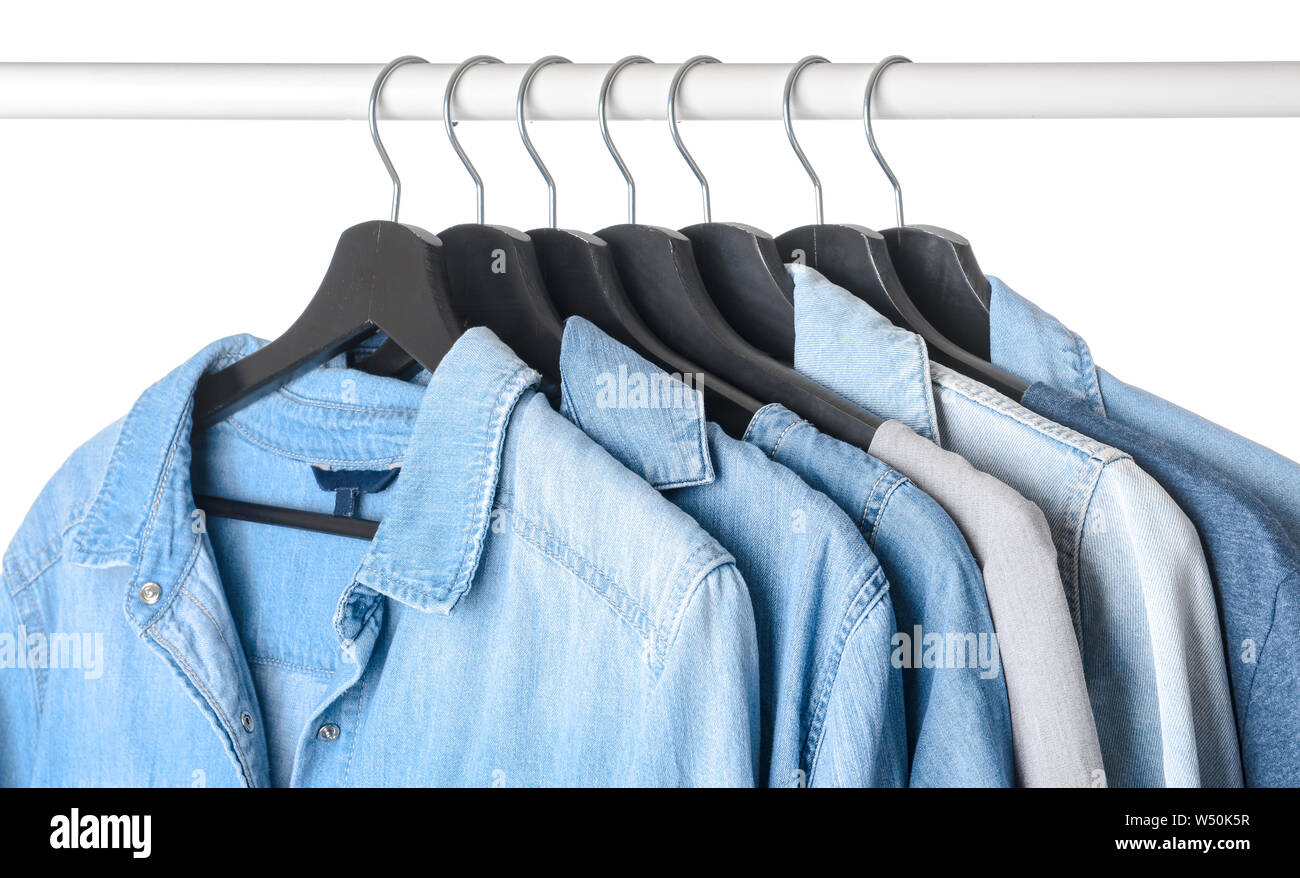 Rack with hanging clothes on white background Stock Photo - Alamy