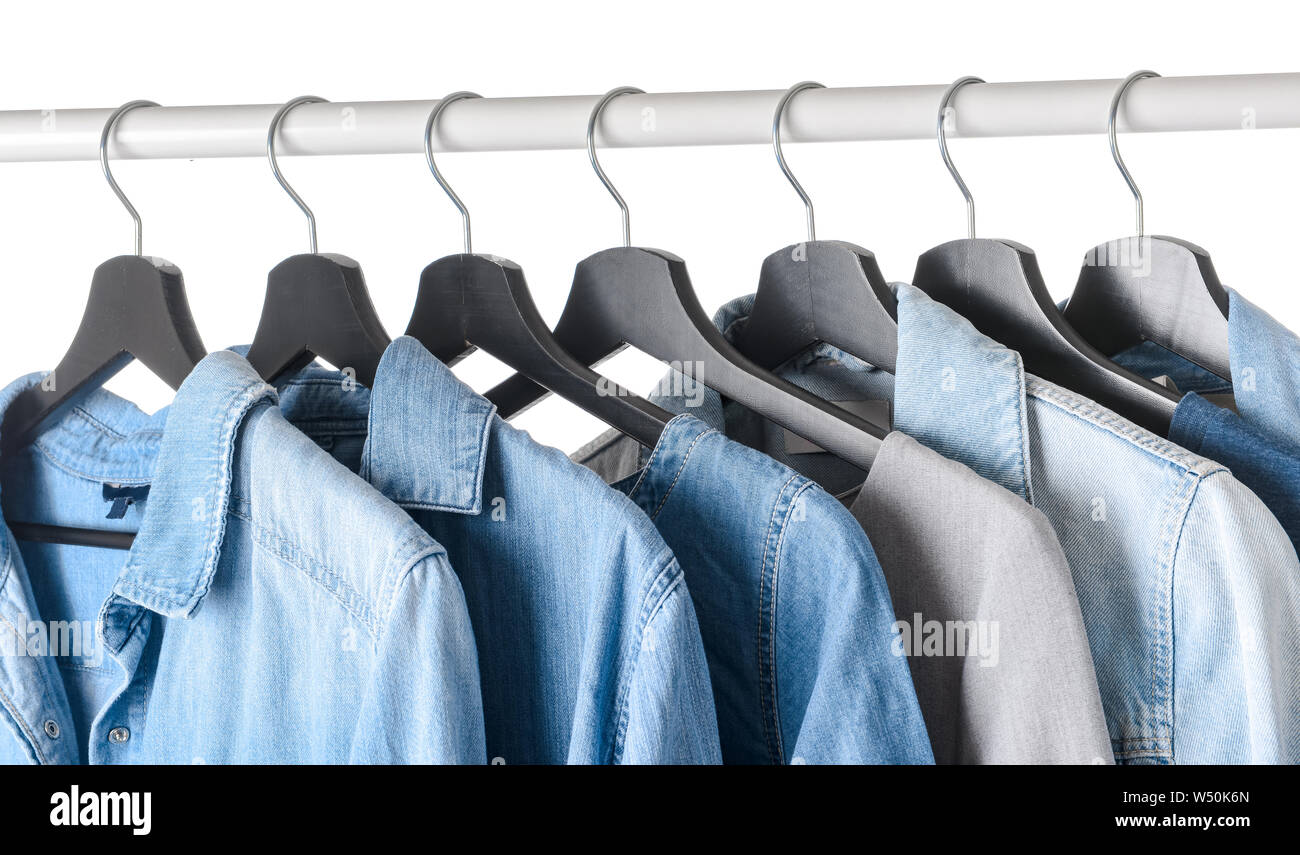 Rack with hanging clothes on white background Stock Photo - Alamy