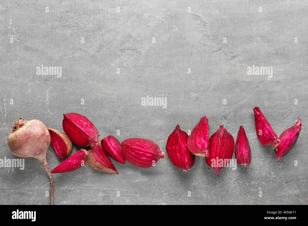 Fresh cut beet on grey background Stock Photo - Alamy