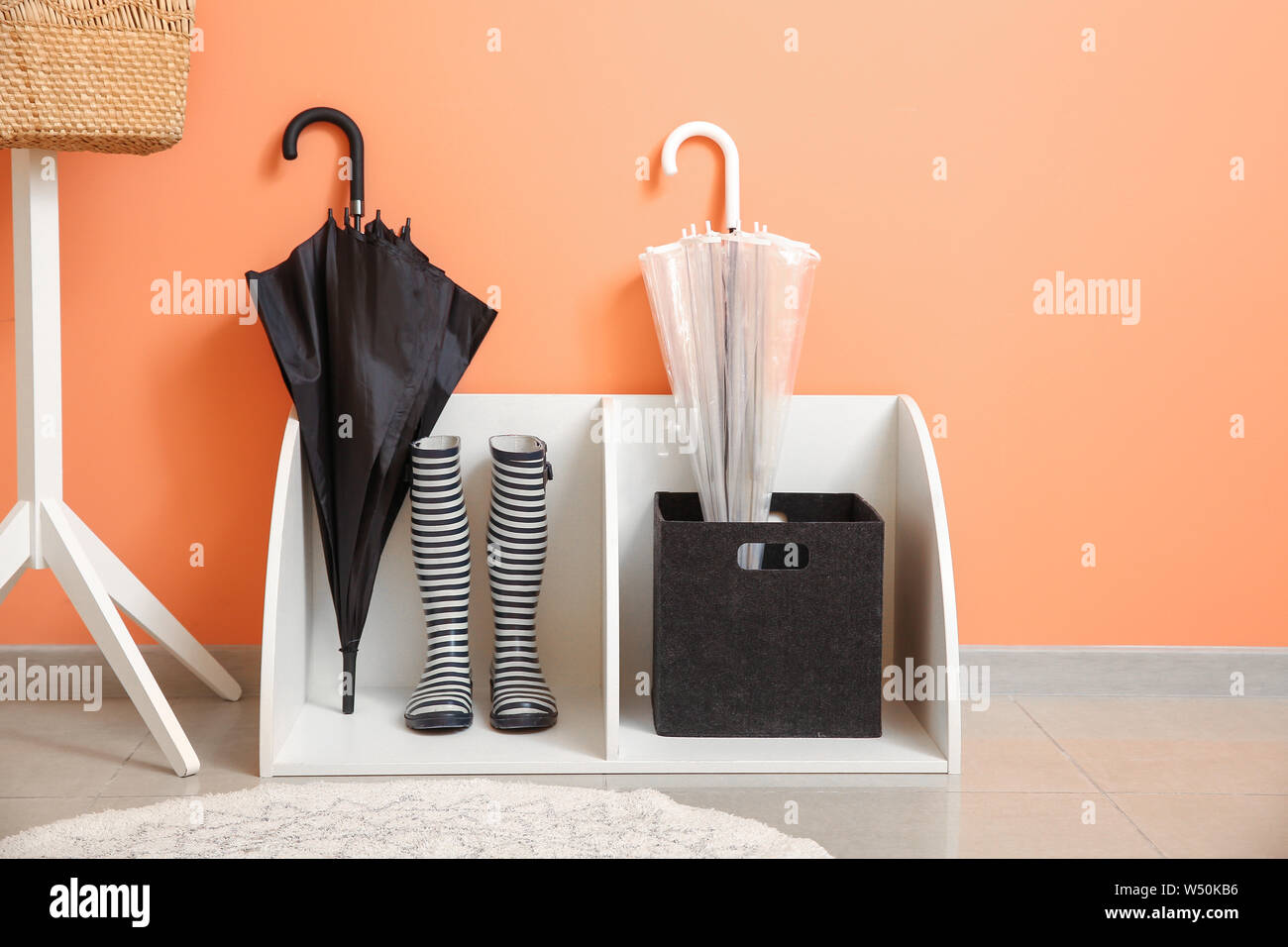 Stylish umbrellas in interior of hall Stock Photo - Alamy