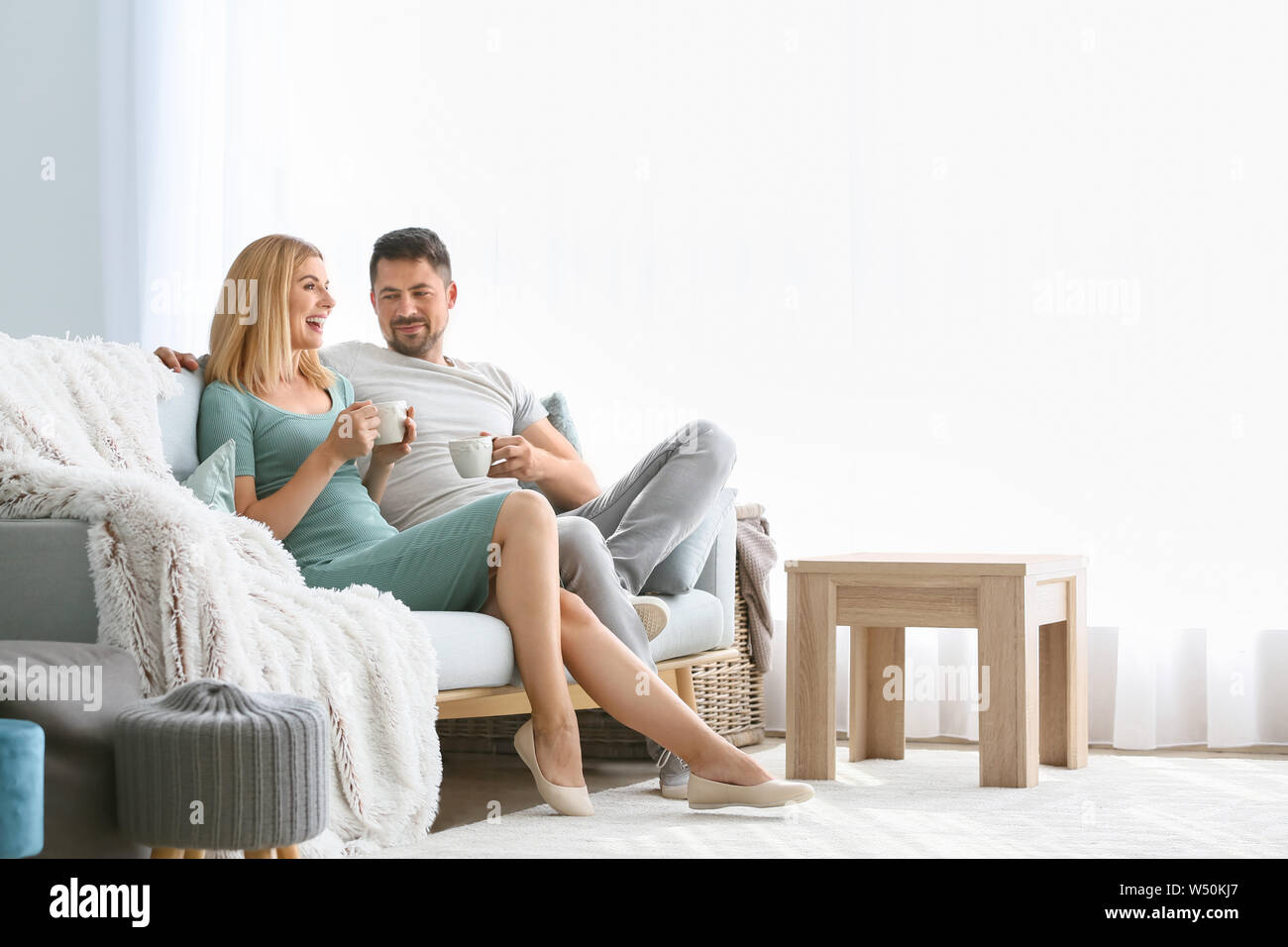 Happy couple in love resting at home Stock Photo - Alamy