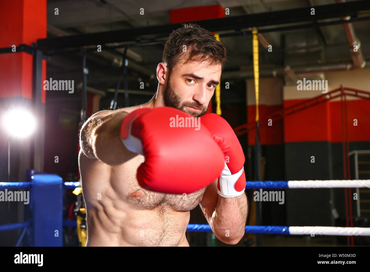 Sporty man in boxing ring Stock Photo - Alamy