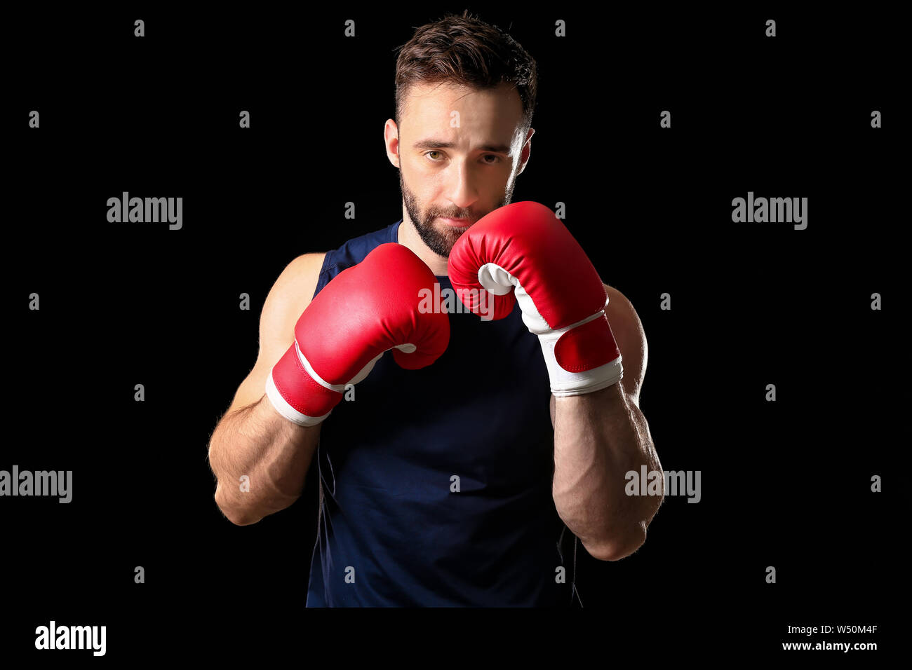 Strong male boxer on dark background Stock Photo - Alamy
